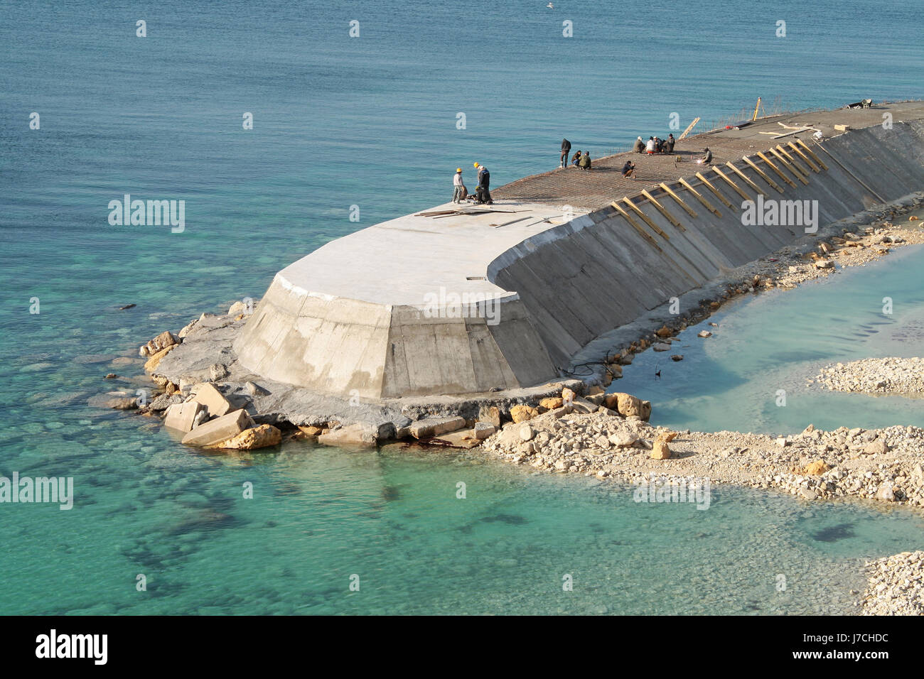 concrete dam embankment salt water sea ocean water nature construction ...
