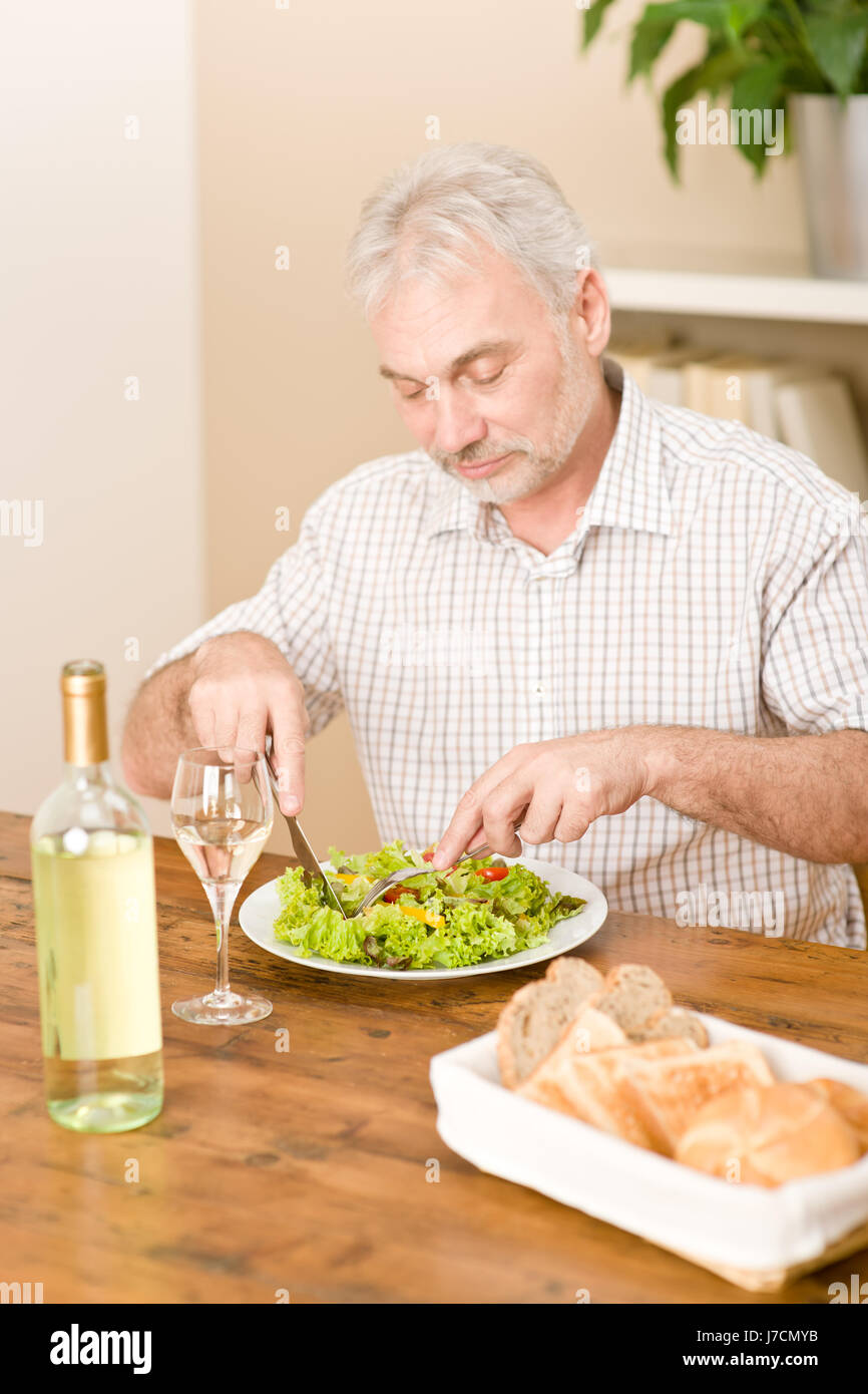 Old man eating dinner alone home hi-res stock photography and images ...
