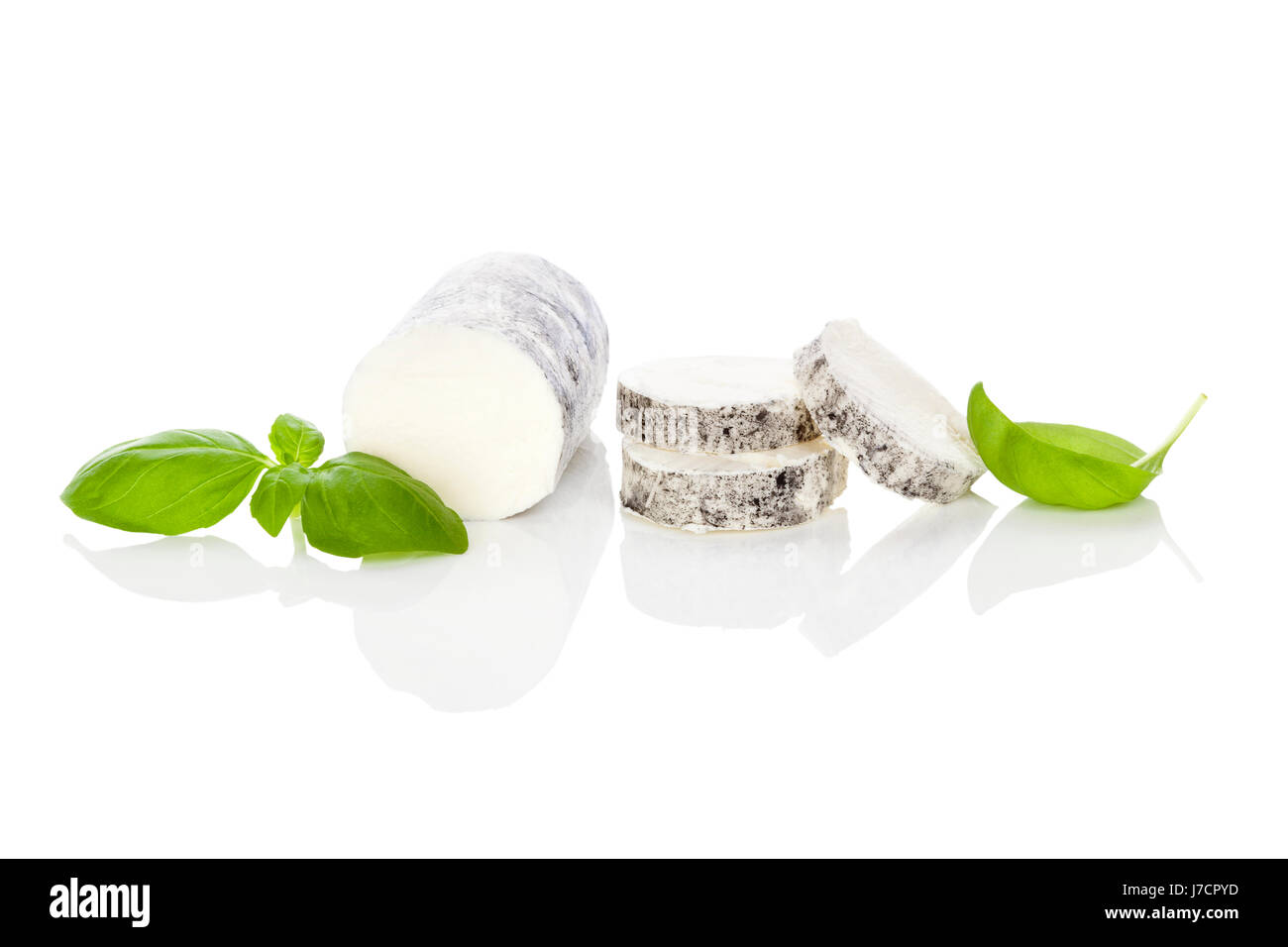 Goat cheese with basil isolated on white background. Culinary cheese ...