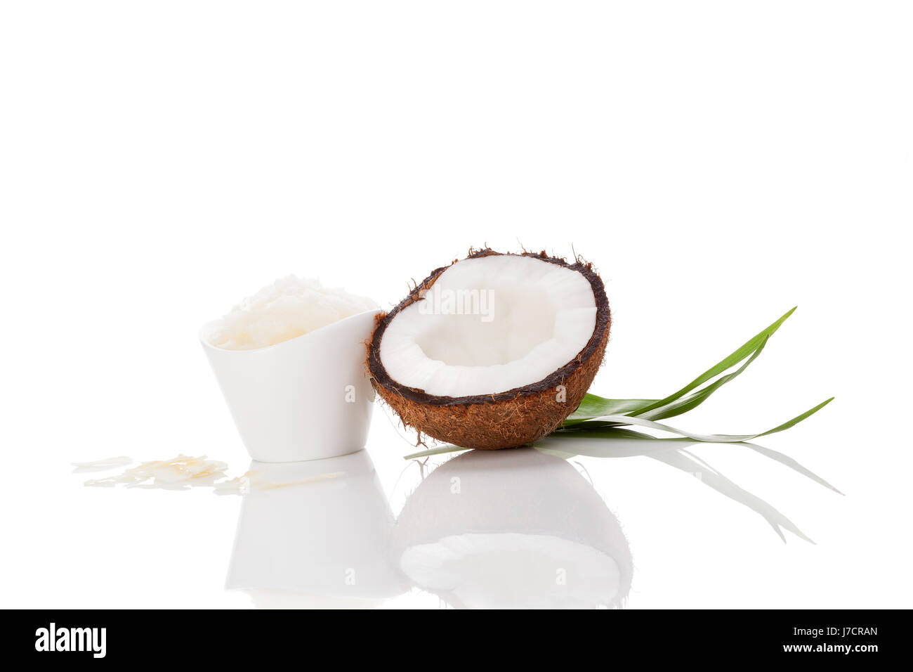 Hard coconut oil and coconut half isolated on white background Stock ...