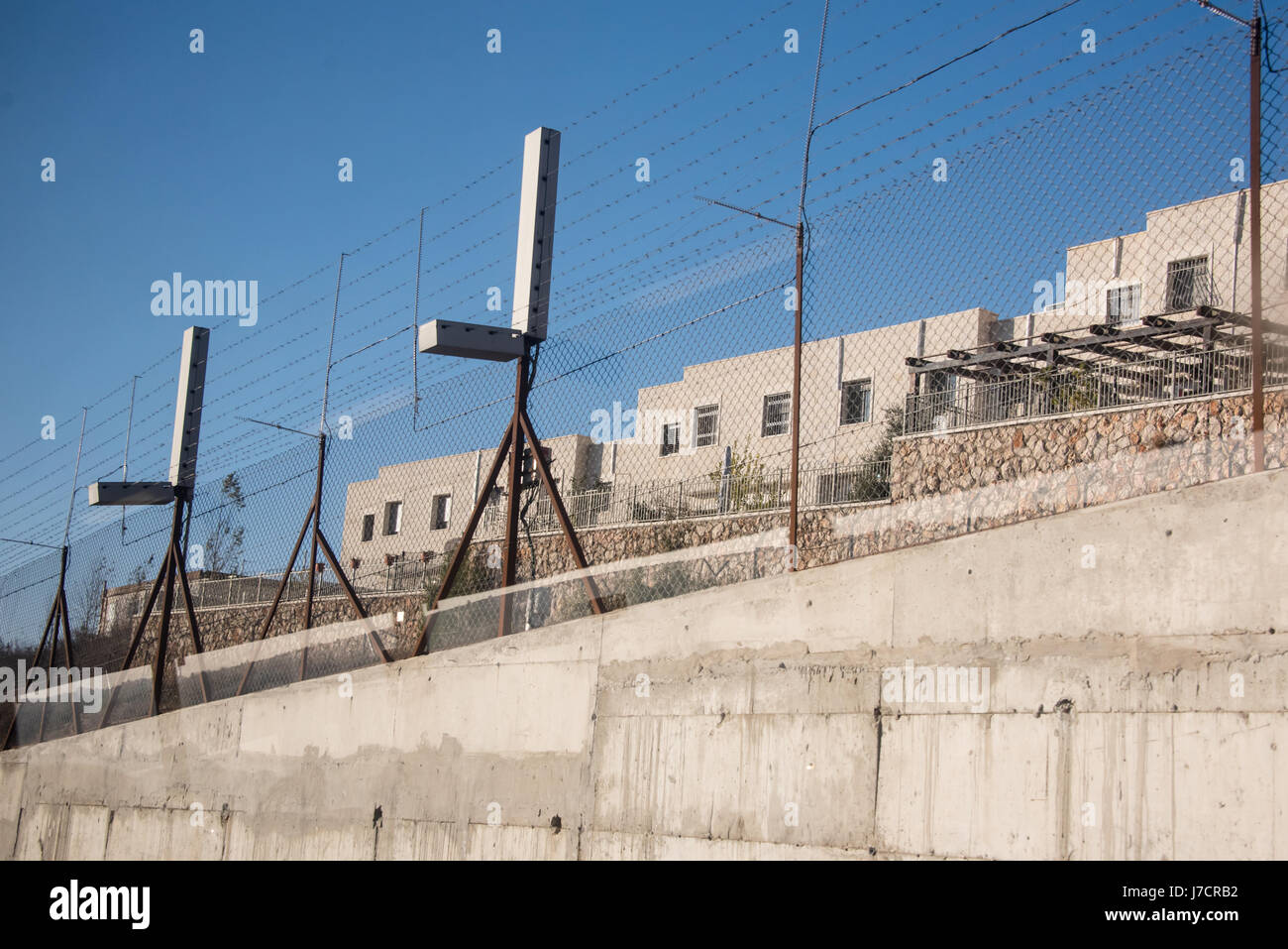 The Israeli Separation Wall encircles the settlement of Har Gilo on ...