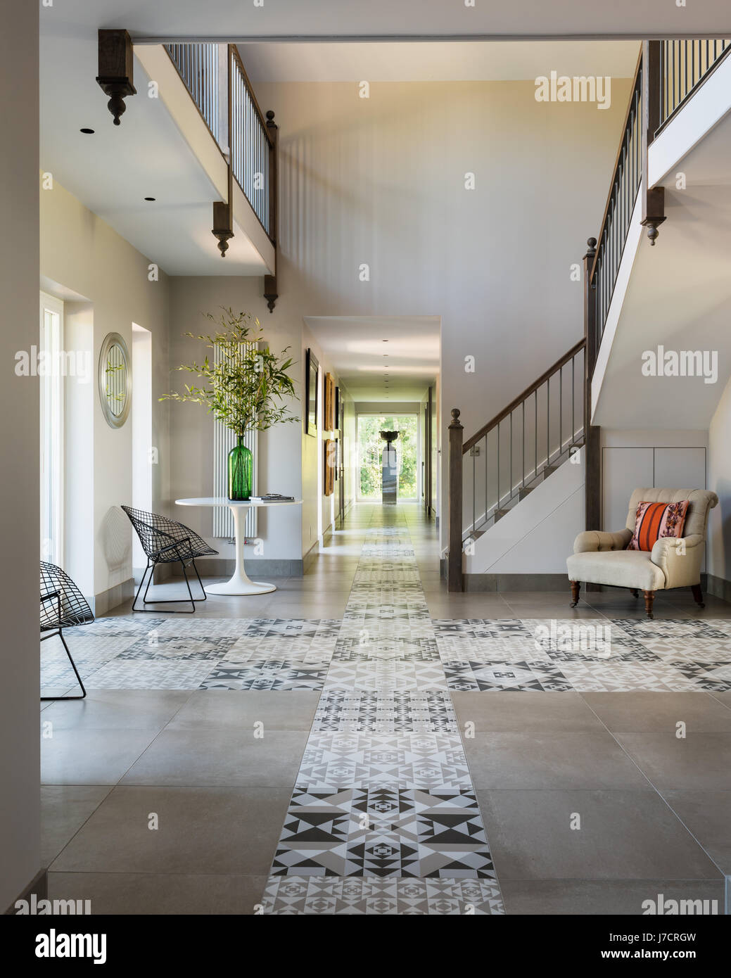 Reconfigured internal entrance with bold tiled floor alternating light ...