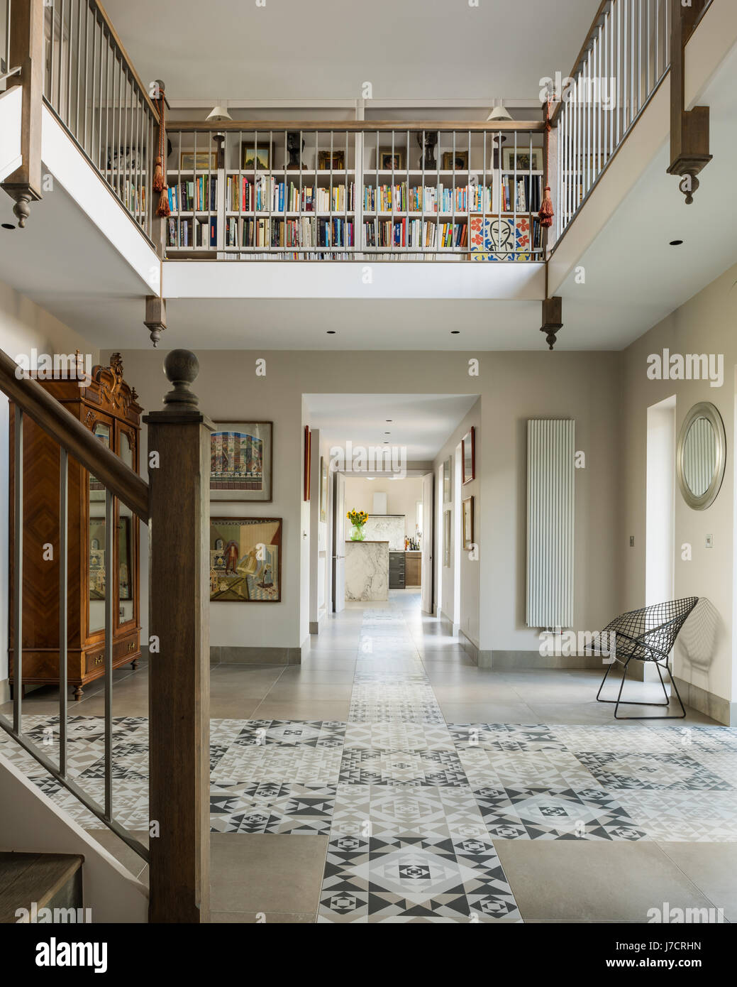 Reconfigured internal mezzanine with bold tiled floor alternating light ...