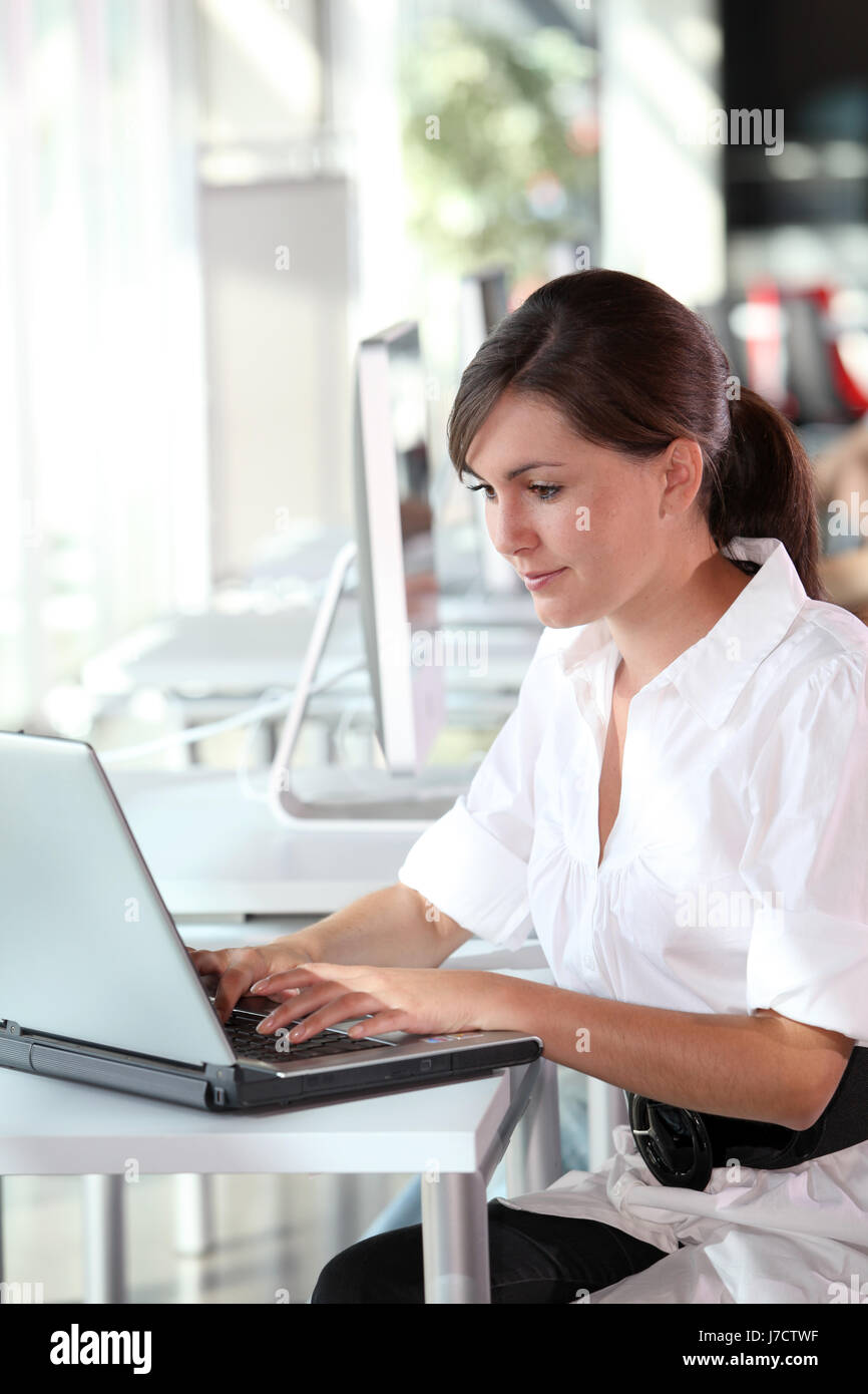 woman bank lending institution office laptop notebook computers ...