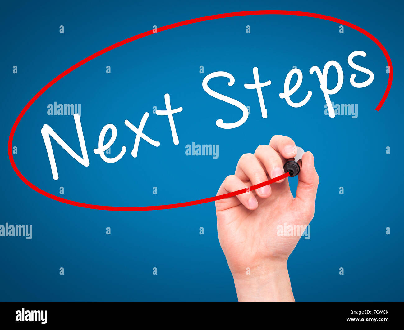 Man Hand writing Next Steps with black marker on visual screen ...