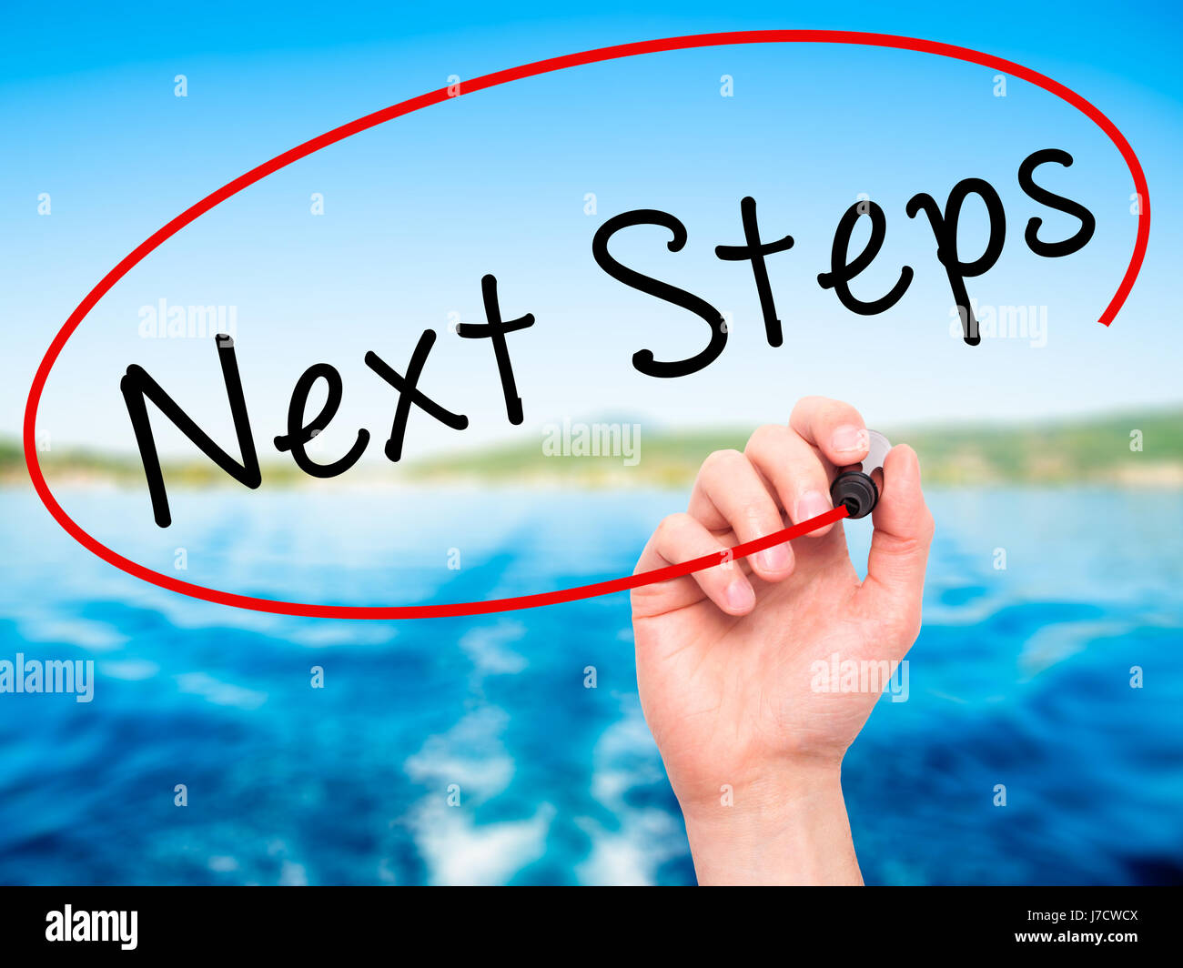 Man Hand writing Next Steps with black marker on visual screen ...