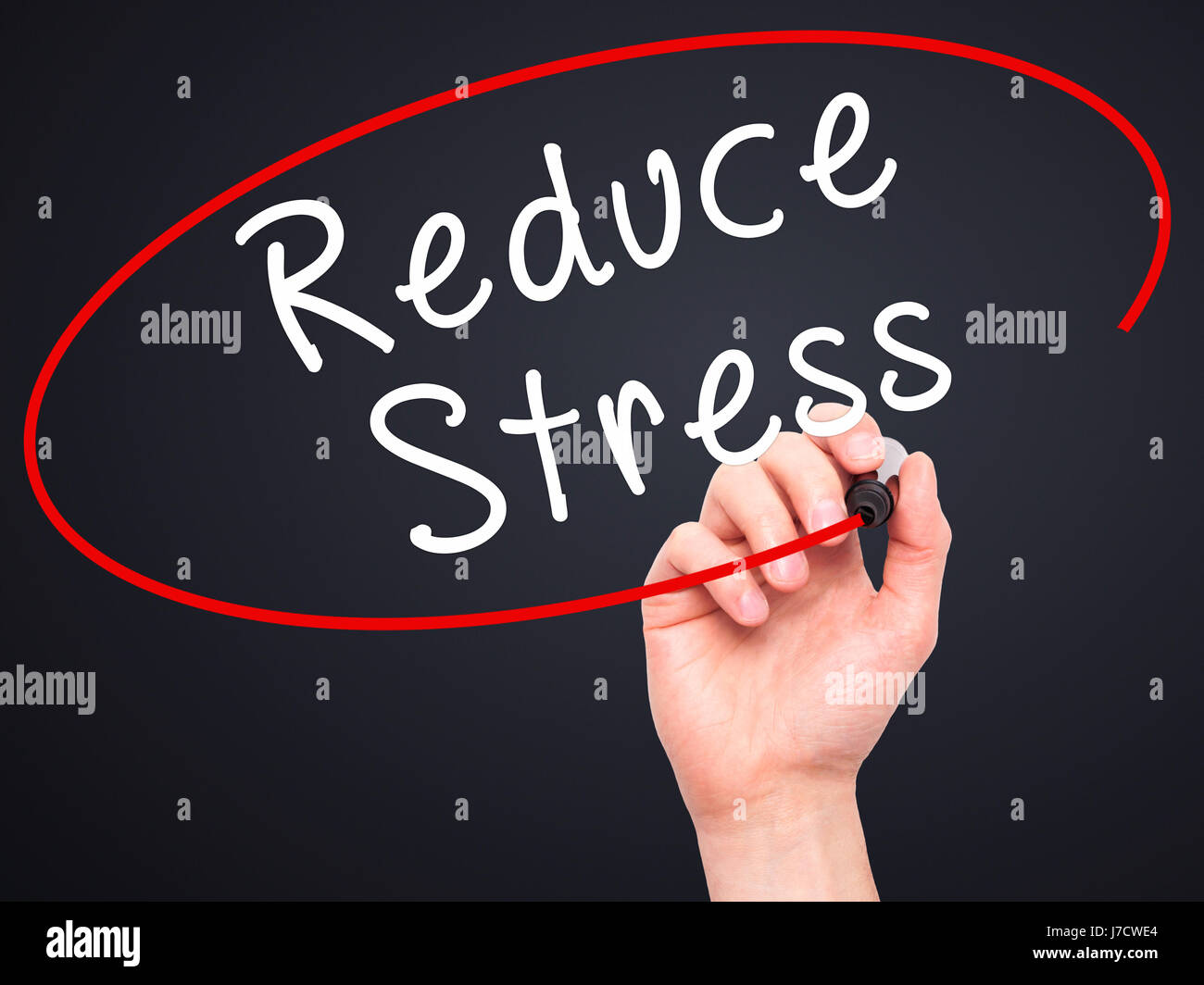 Man Hand writing Reduce Stress with black marker on visual screen ...
