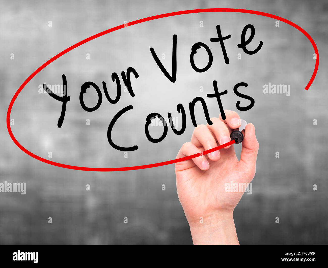 Man Hand writing Your Vote Counts with black marker on visual screen ...