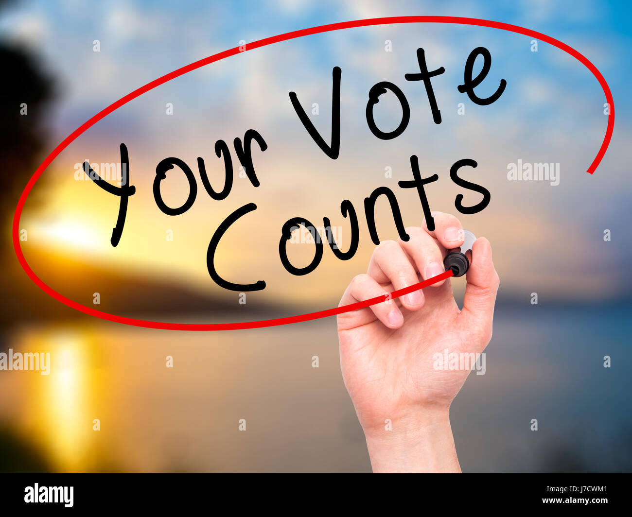Man Hand writing Your Vote Counts with black marker on visual screen ...
