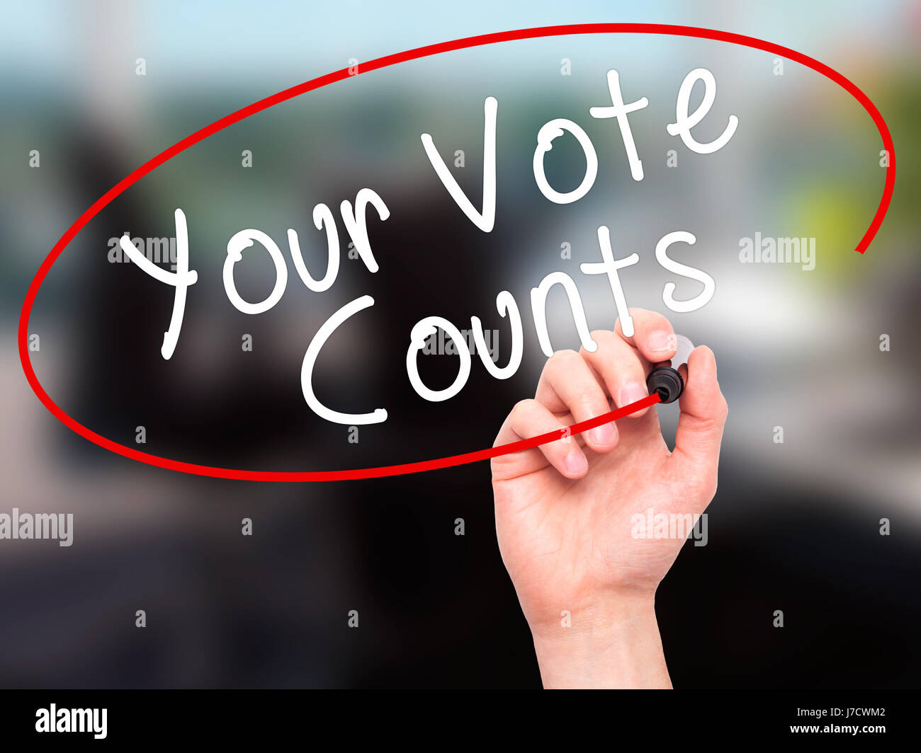 Man Hand writing Your Vote Counts with black marker on visual screen ...