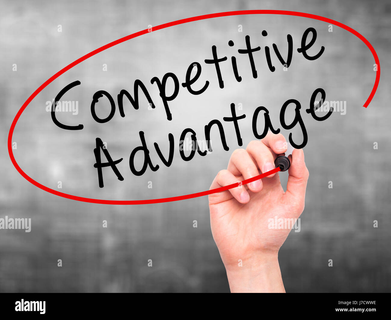 Man Hand writing Competitive Advantage with black marker on visual ...