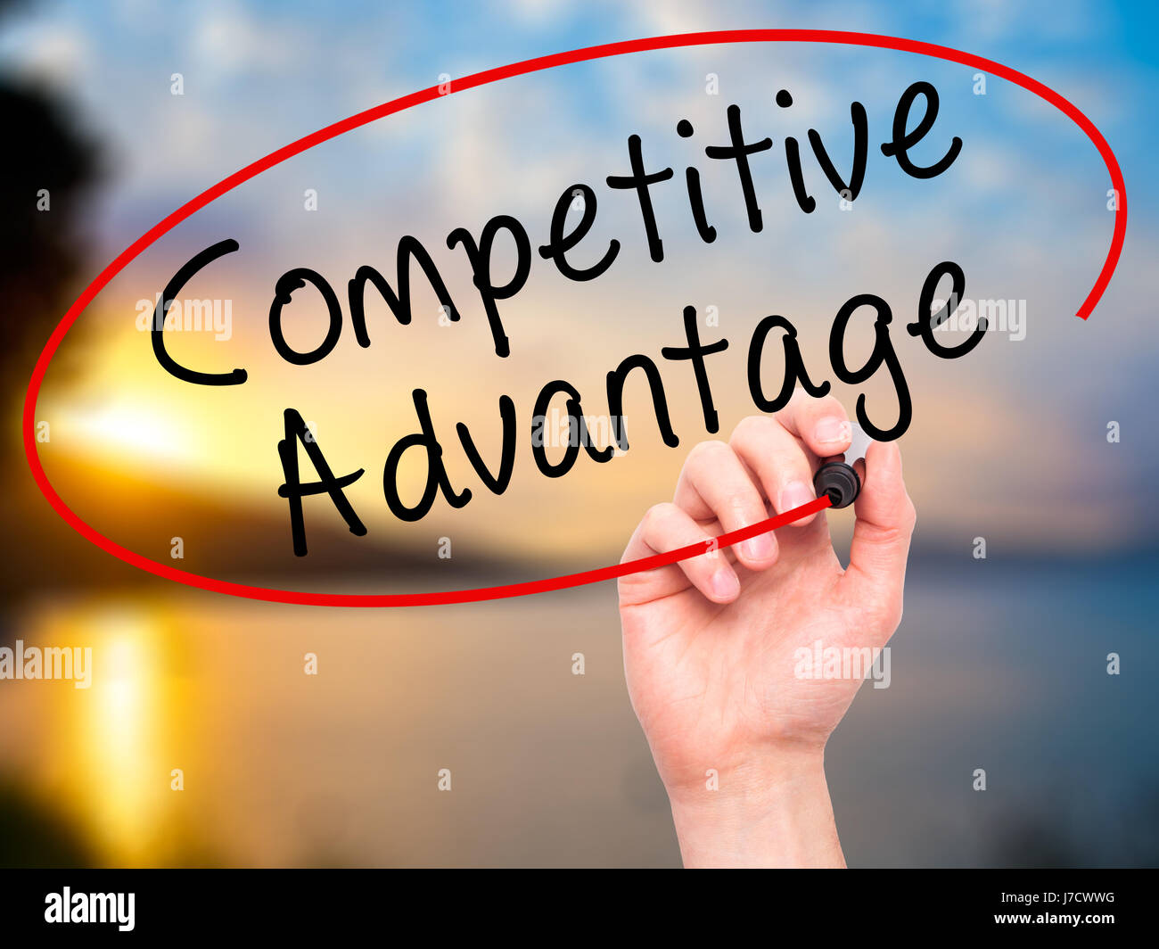 Man Hand writing Competitive Advantage with black marker on visual ...