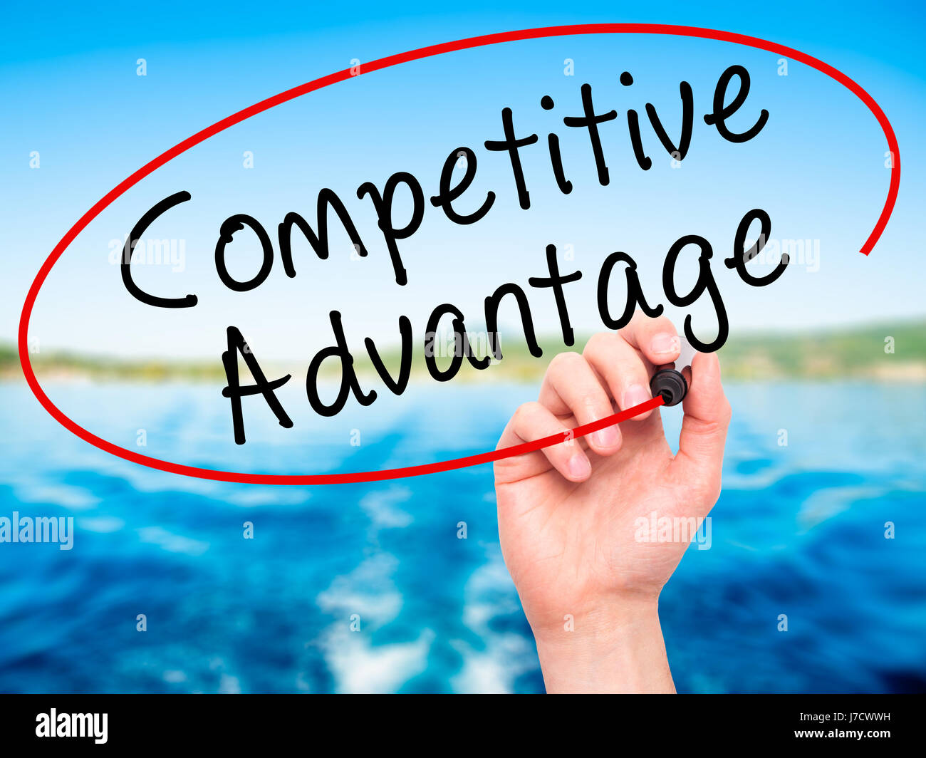 Man Hand writing Competitive Advantage with black marker on visual ...