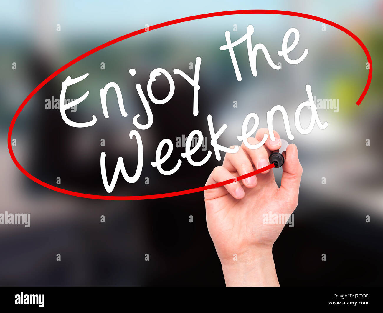 Man Hand writing Enjoy the Weekend with black marker on visual screen ...