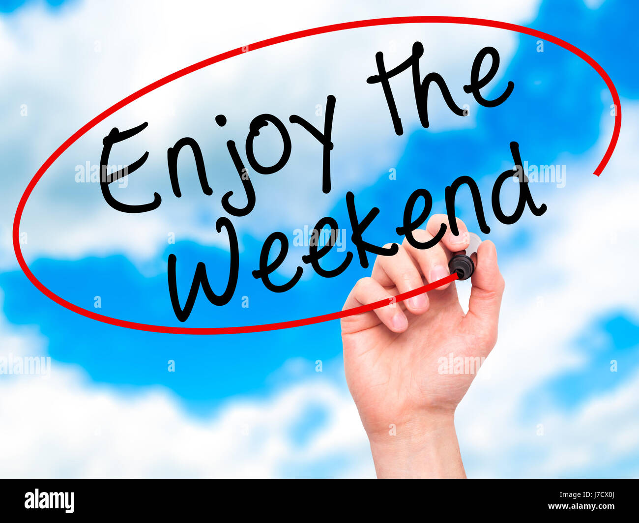 Man Hand writing Enjoy the Weekend with black marker on visual screen ...