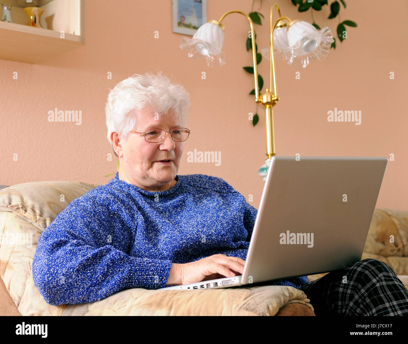 senior with laptop Stock Photo - Alamy