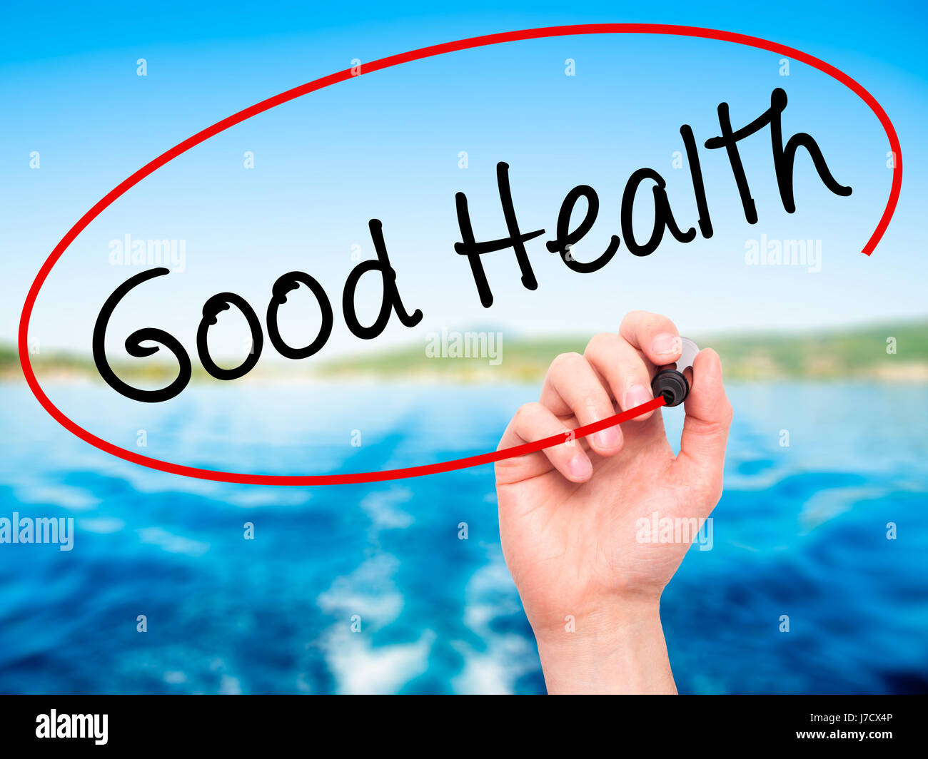 Man Hand writing Good Health with black marker on visual screen ...