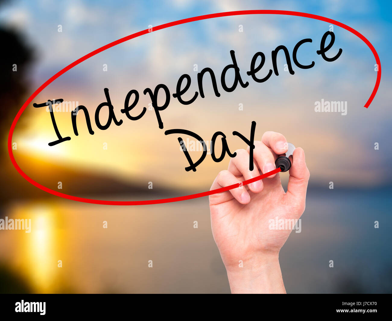 Man Hand writing Independence Day with black marker on visual screen ...