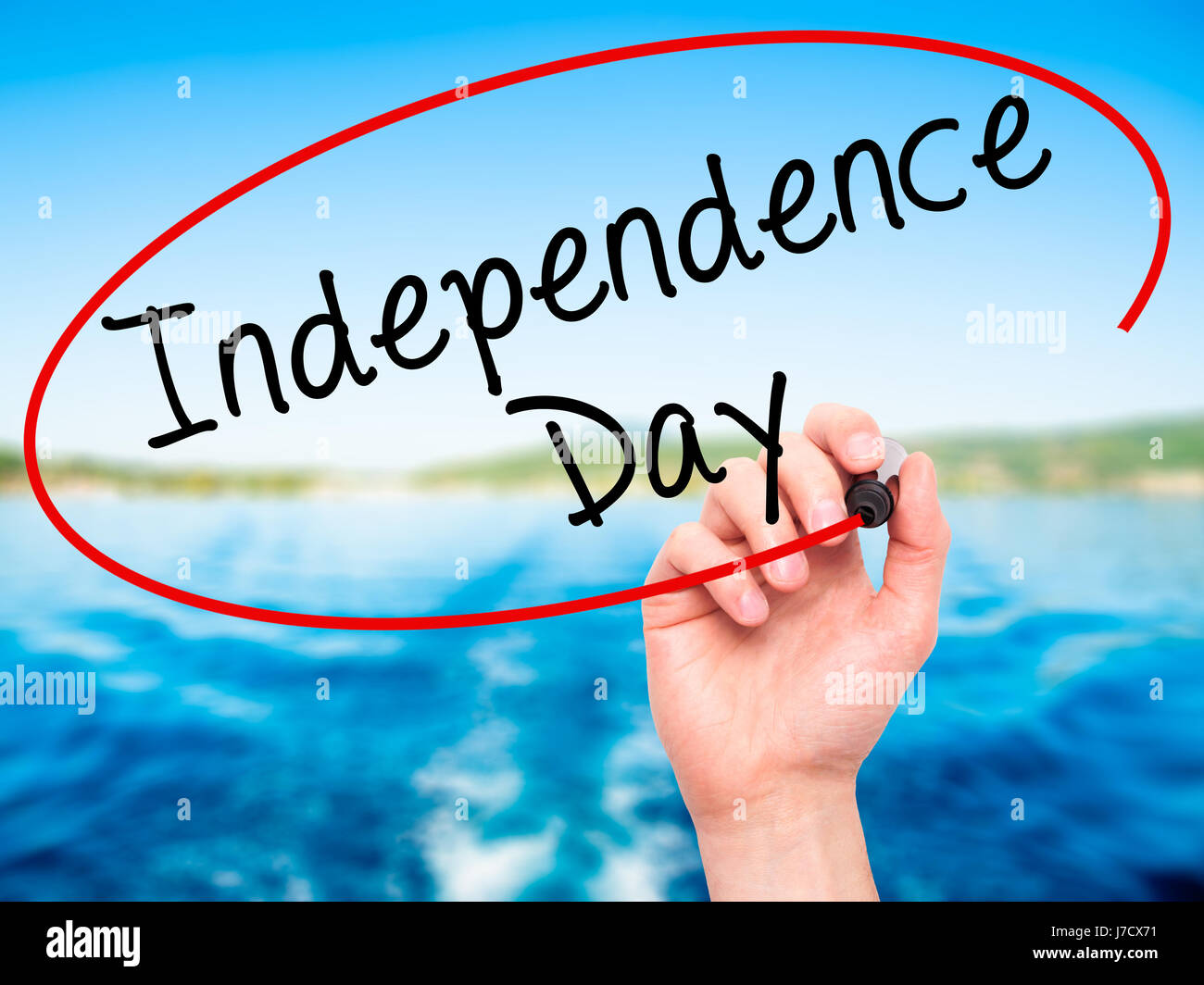 Man Hand writing Independence Day with black marker on visual screen ...