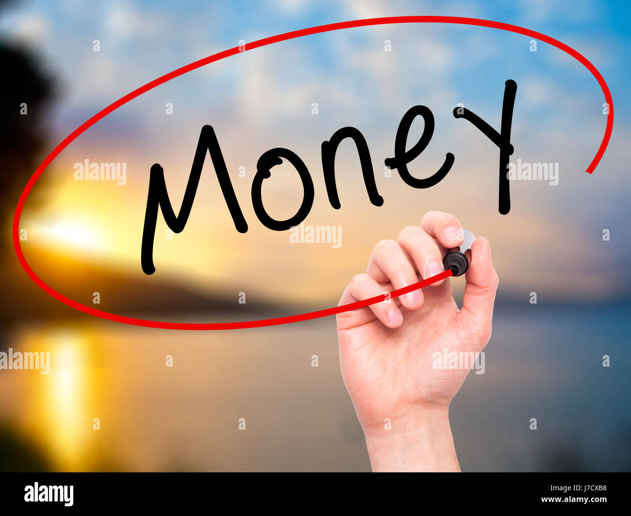 Man Hand writing Money with black marker on visual screen. Isolated on ...