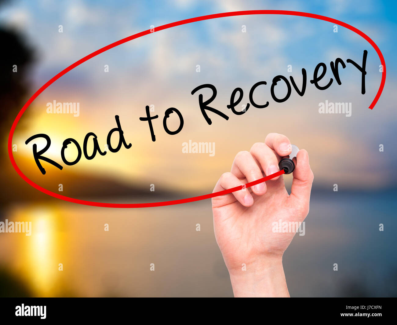 Man Hand writing Road to Recovery with black marker on visual screen ...