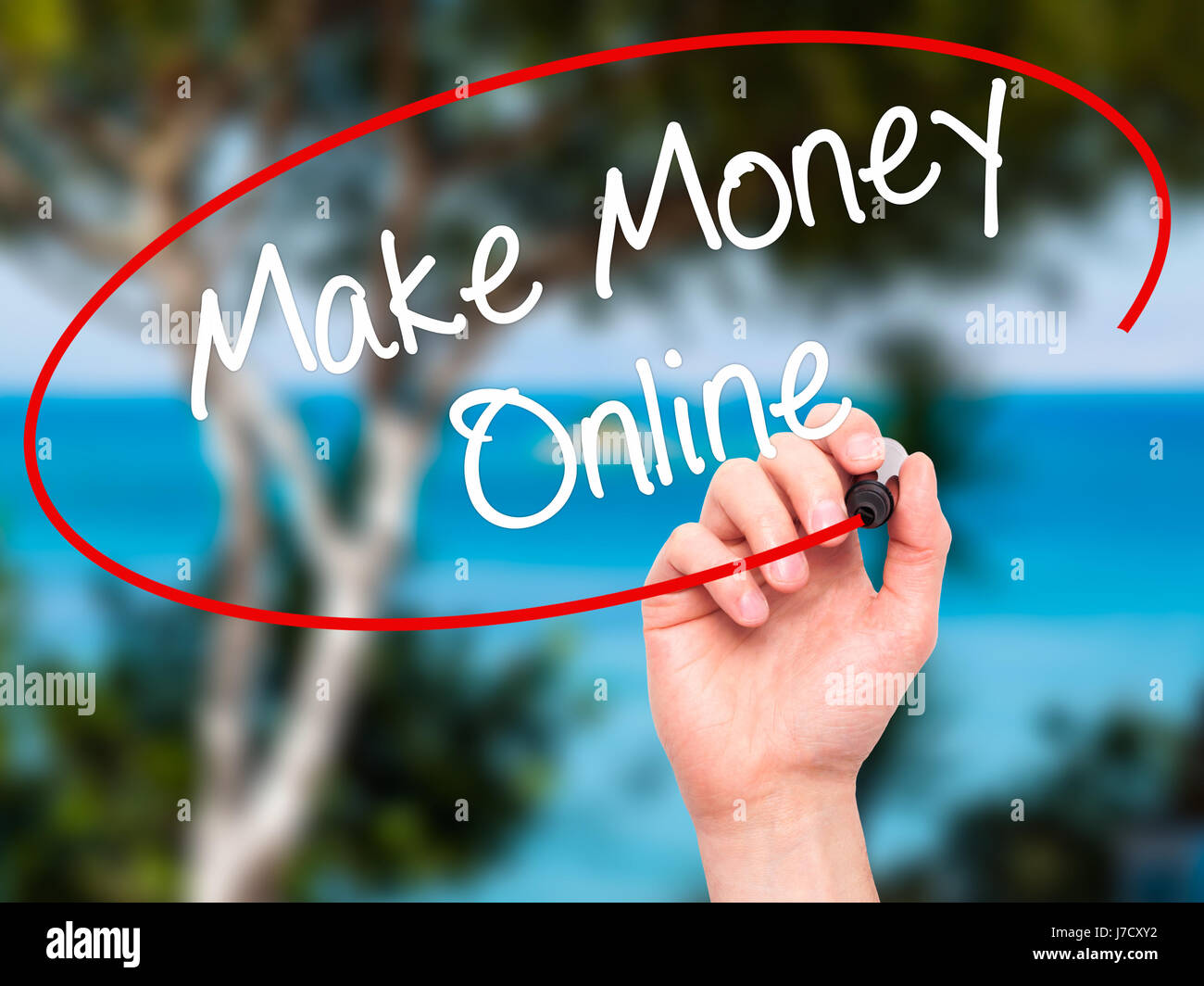 Man Hand writing Make Money Online with black marker on visual screen ...