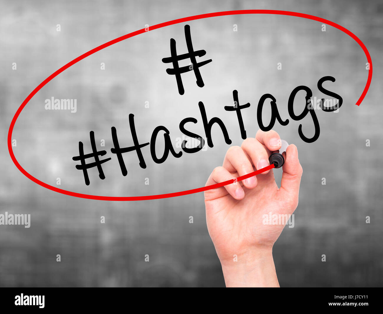 Man Hand writing #Hashtags with black marker on visual screen. Isolated ...