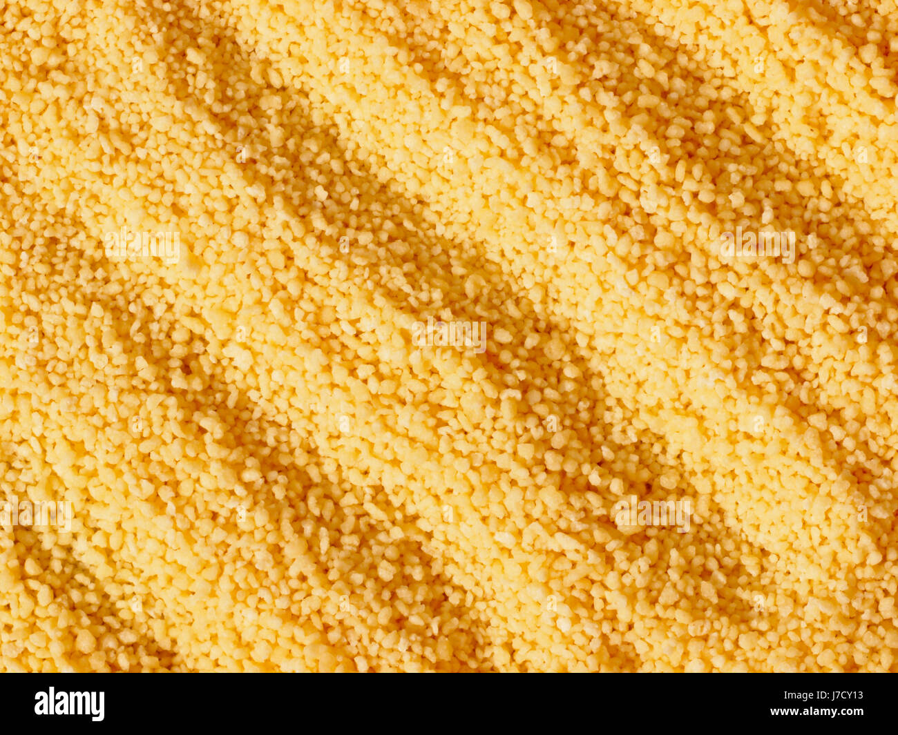 African wheat semolina granules couscous food aliment colour closeup ...