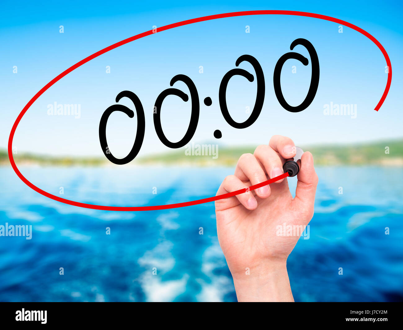 Man Hand writing 00:00 with black marker on visual screen. Isolated on ...
