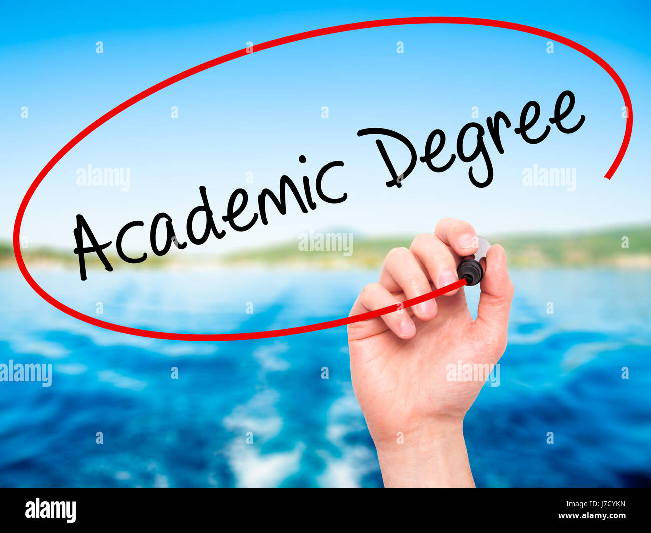 Man Hand writing Academic Degree with black marker on visual screen ...
