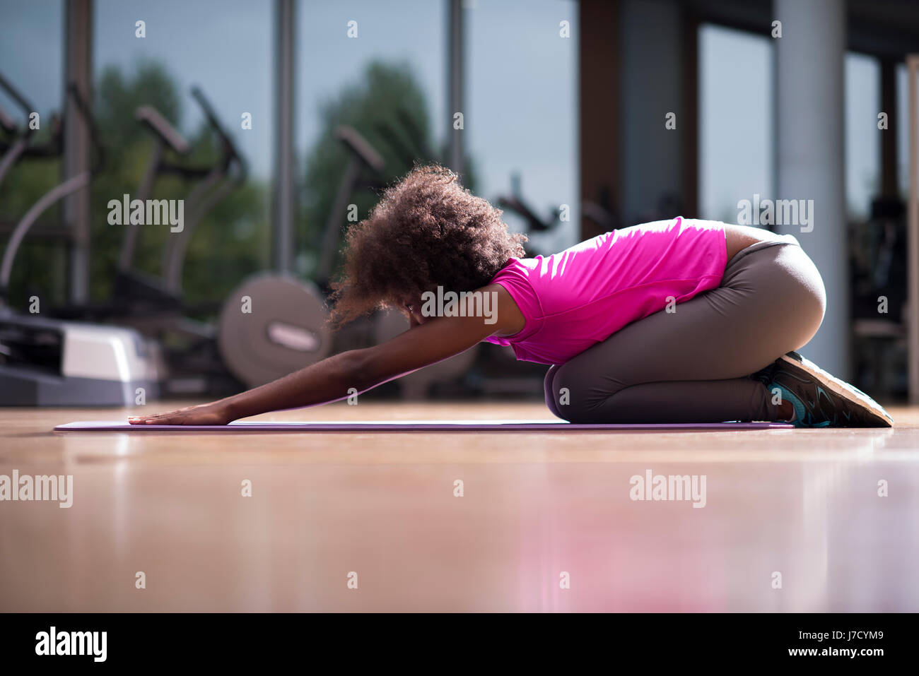 beautiful young african american woman exercise yoga in gym Stock Photo ...