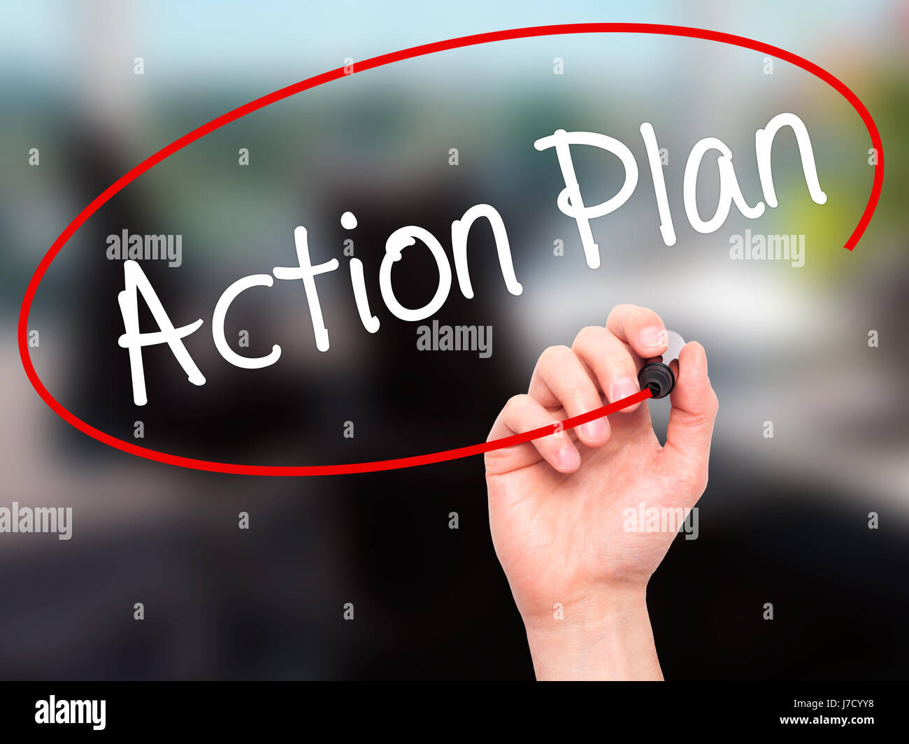 Man Hand writing Action Plan with black marker on visual screen ...