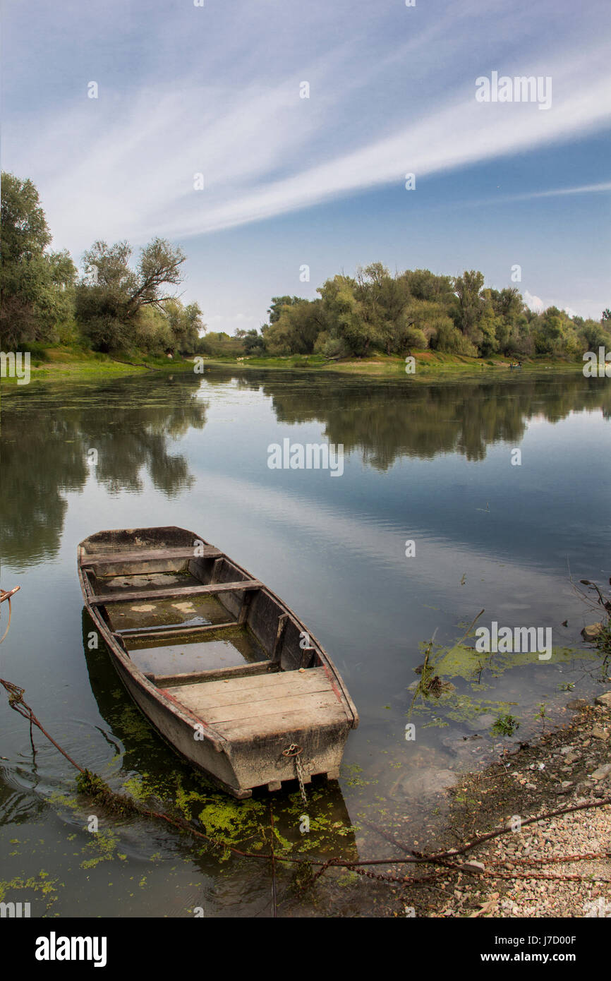 Lonely boat on the river Stock Photo - Alamy