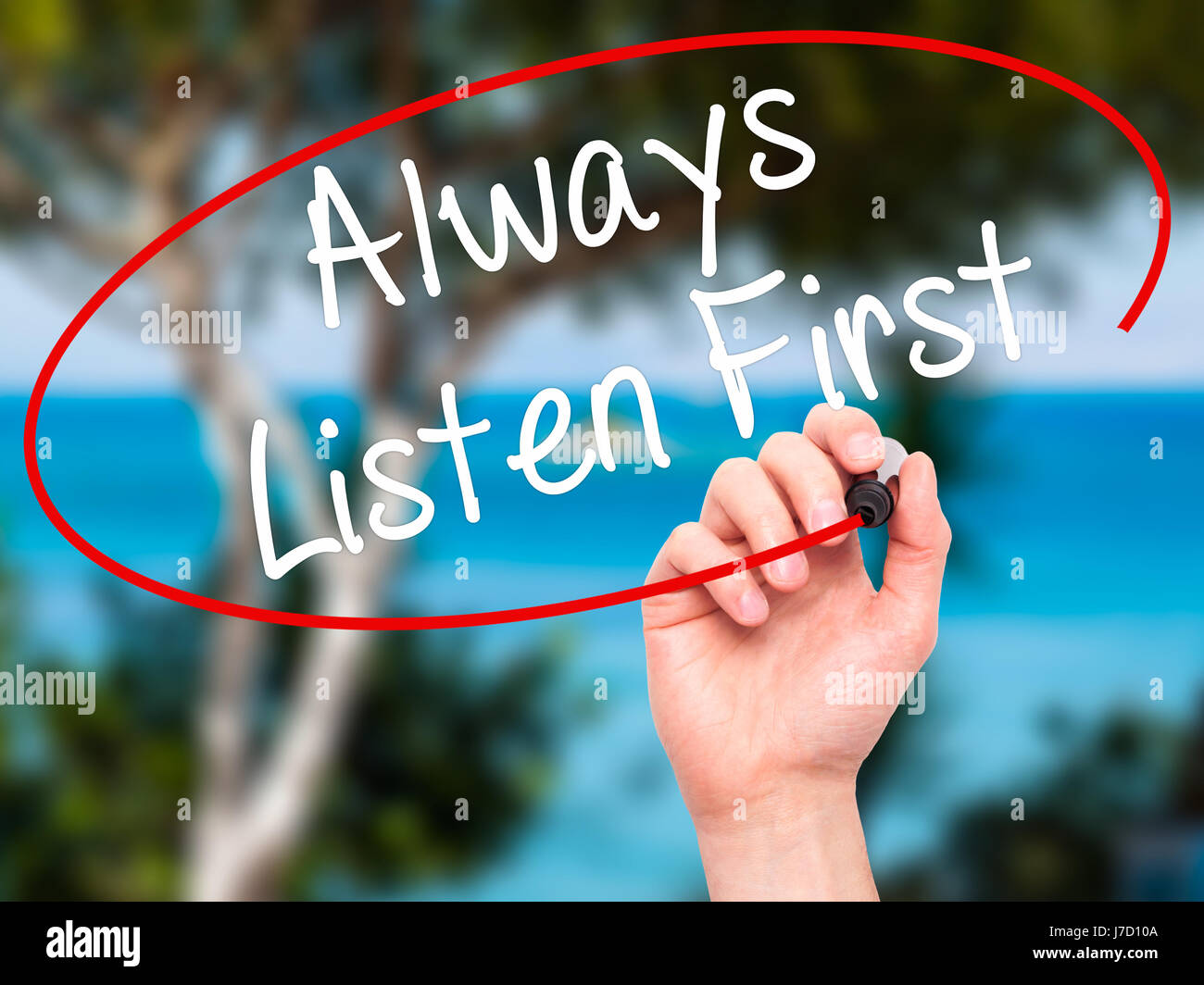 Man Hand writing Always Listen First with black marker on visual screen ...