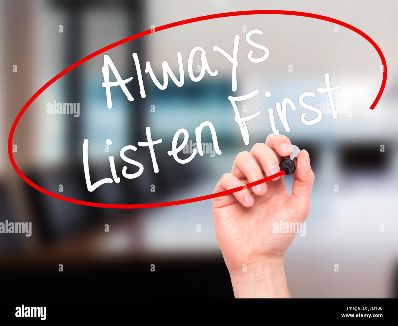 Man Hand writing Always Listen First with black marker on visual screen ...