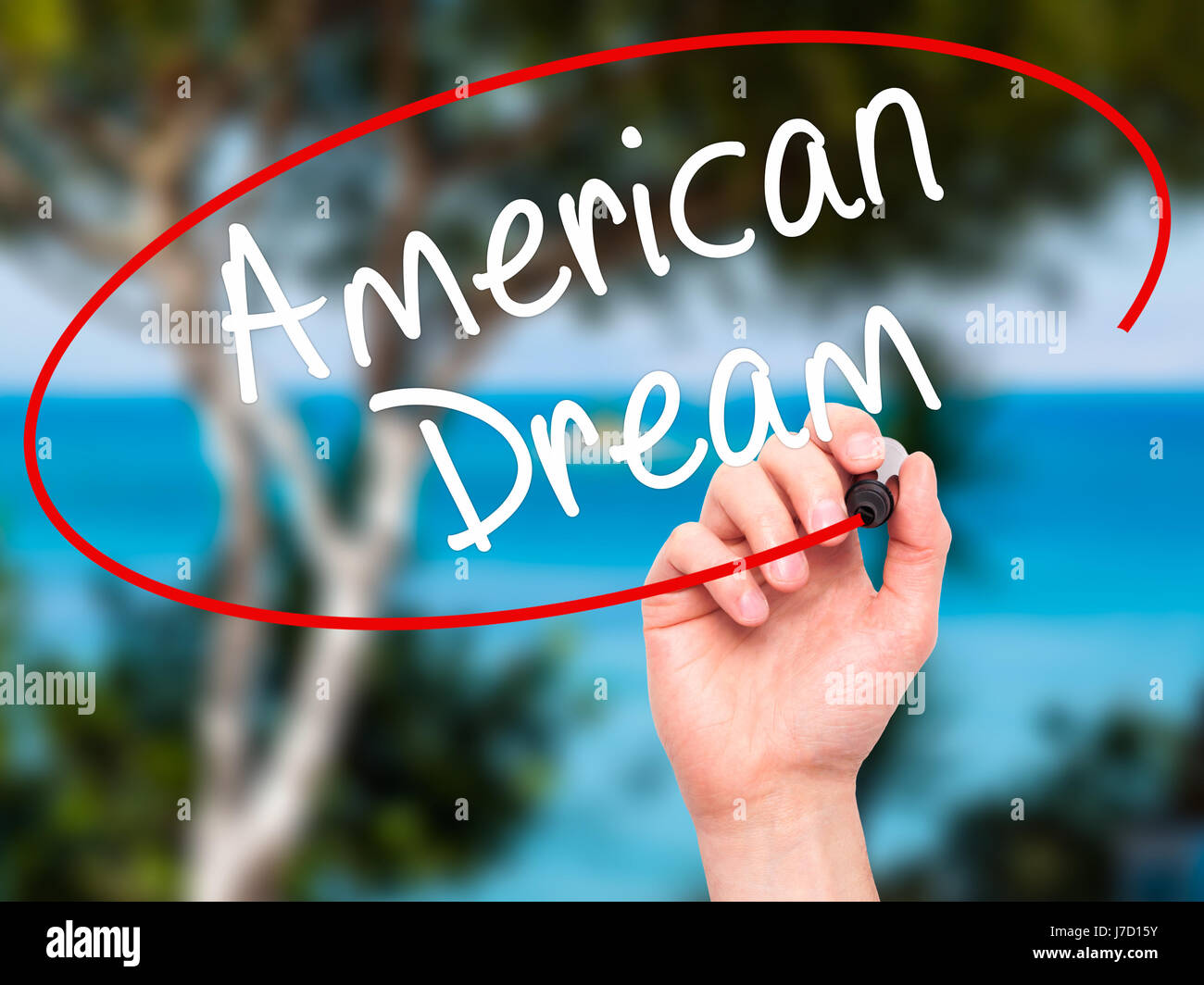 Man Hand writing American Dream with black marker on visual screen ...