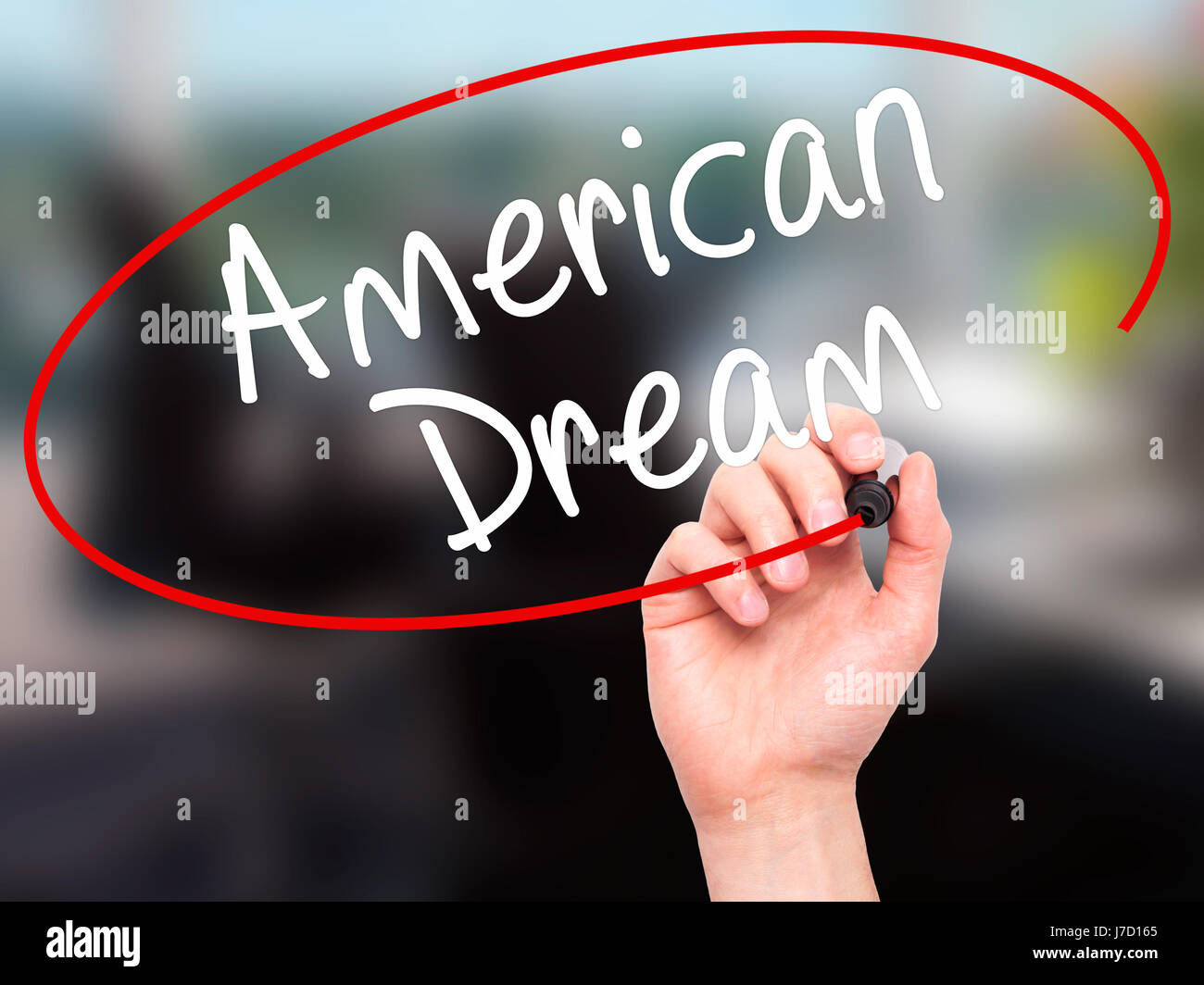 Man Hand writing American Dream with black marker on visual screen ...