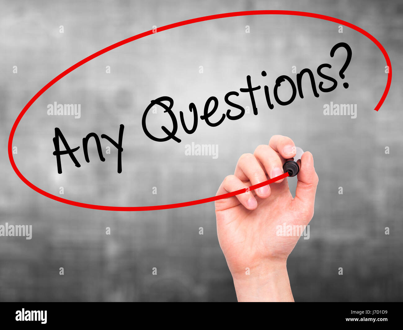 Man Hand writing Any Questions? with black marker on visual screen ...