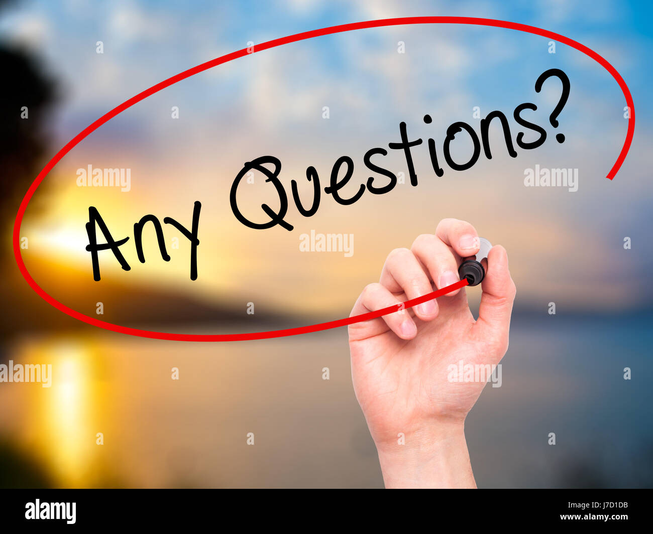 Man Hand writing Any Questions? with black marker on visual screen ...