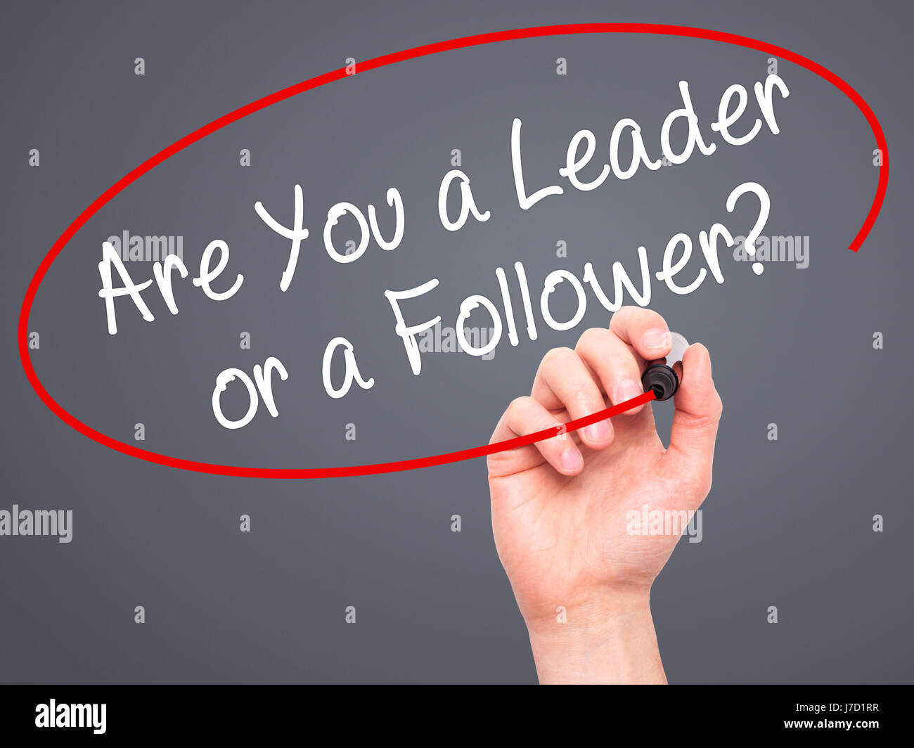 Man Hand writing Are You a Leader or a Follower? with black marker on ...
