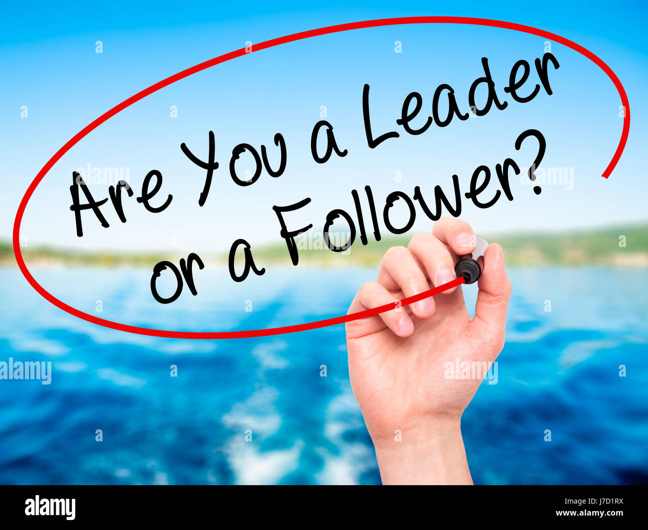 Man Hand writing Are You a Leader or a Follower? with black marker on ...