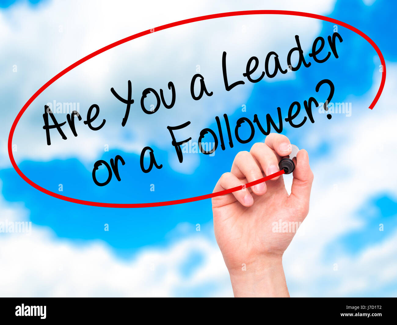 Man Hand writing Are You a Leader or a Follower? with black marker on ...