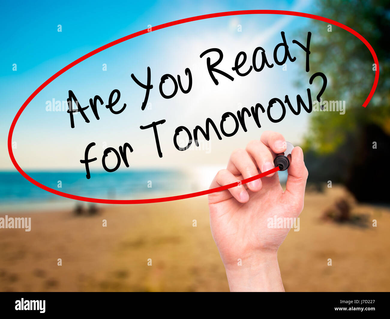 Man Hand writing Are You Ready for Tomorrow? with black marker on ...