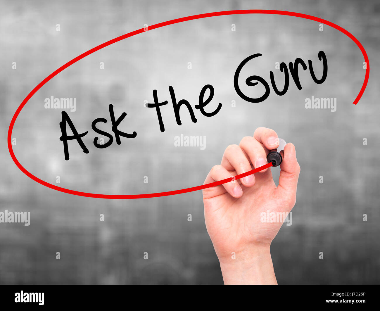 Man Hand writing Ask the Guru with black marker on visual screen ...