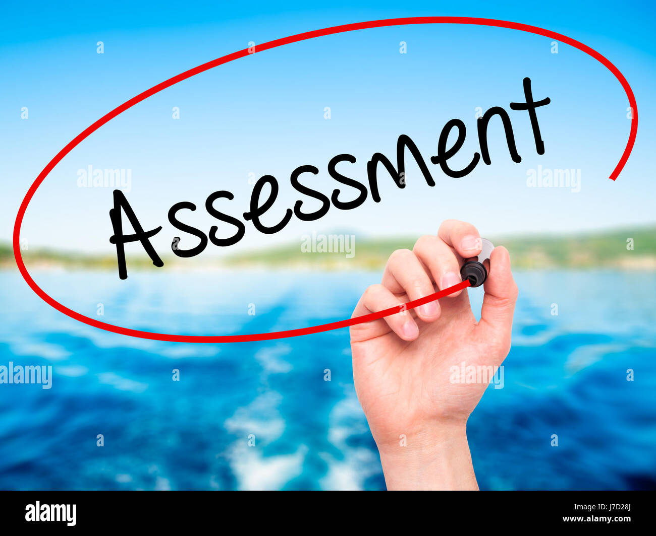 Man Hand writing Assessment with black marker on visual screen ...