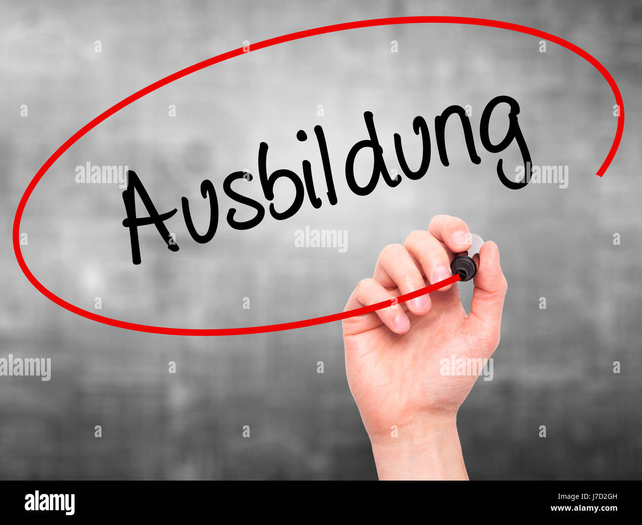 Man Hand writing Ausbildung (Education in German) with black marker on ...