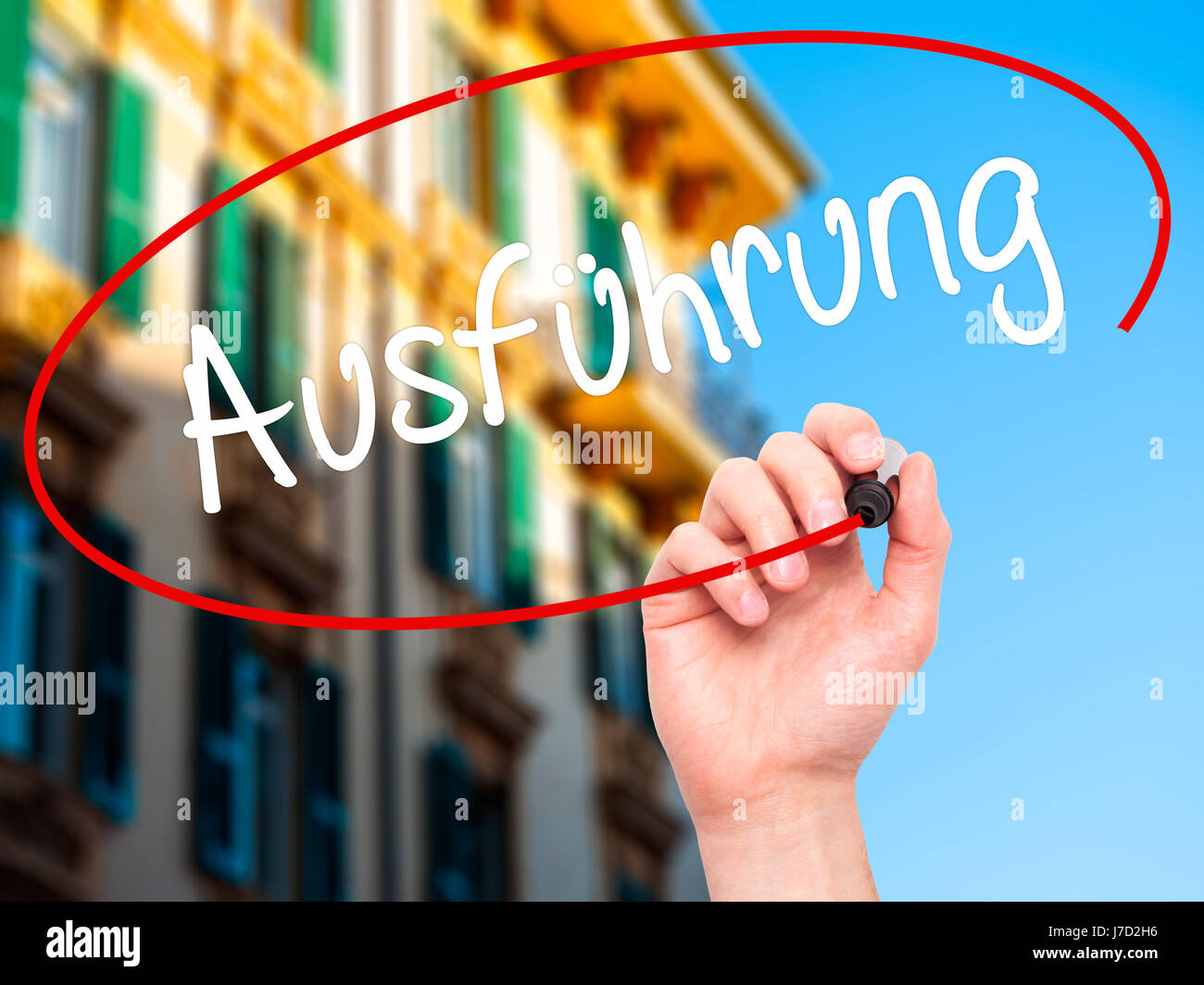 Man Hand writing Ausfuhrung (Execution in German) with black marker on ...