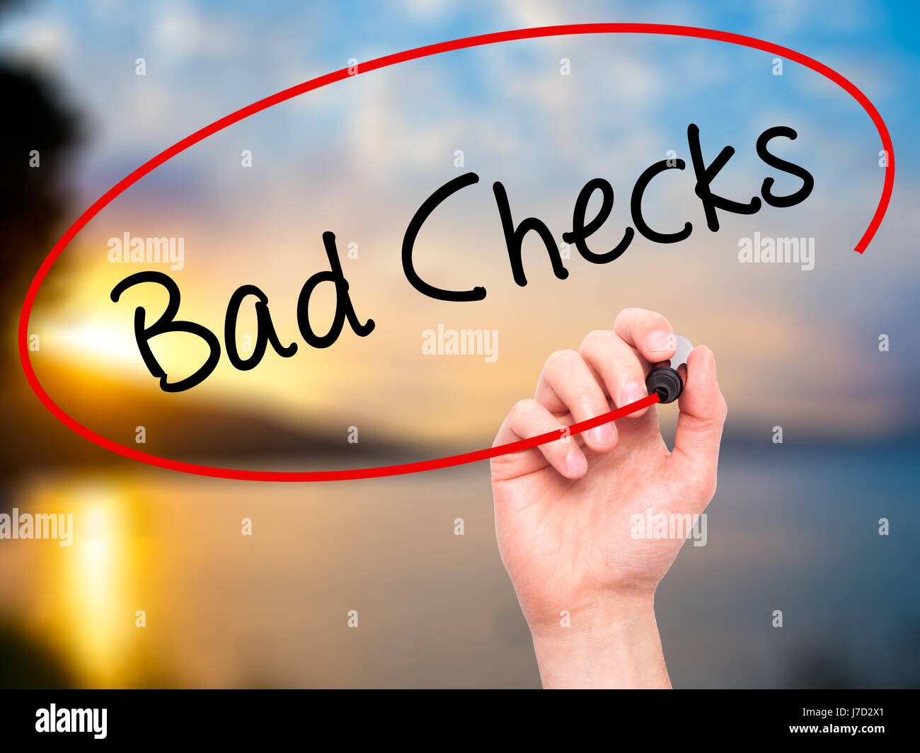 Man Hand writing Bad Checks with black marker on visual screen ...