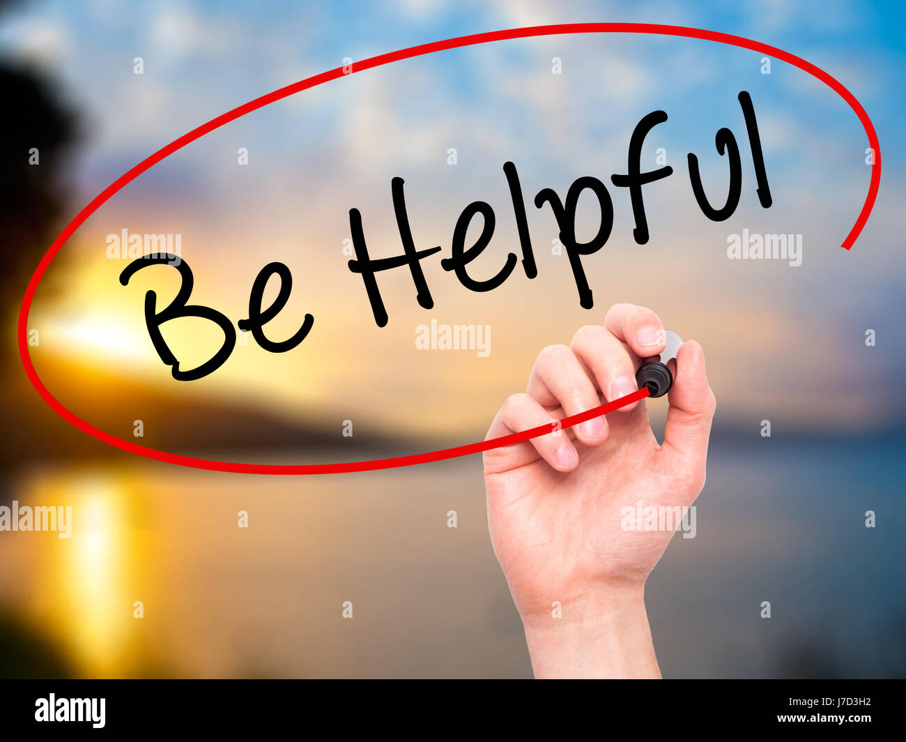 Man Hand writing Be Helpful with black marker on visual screen ...