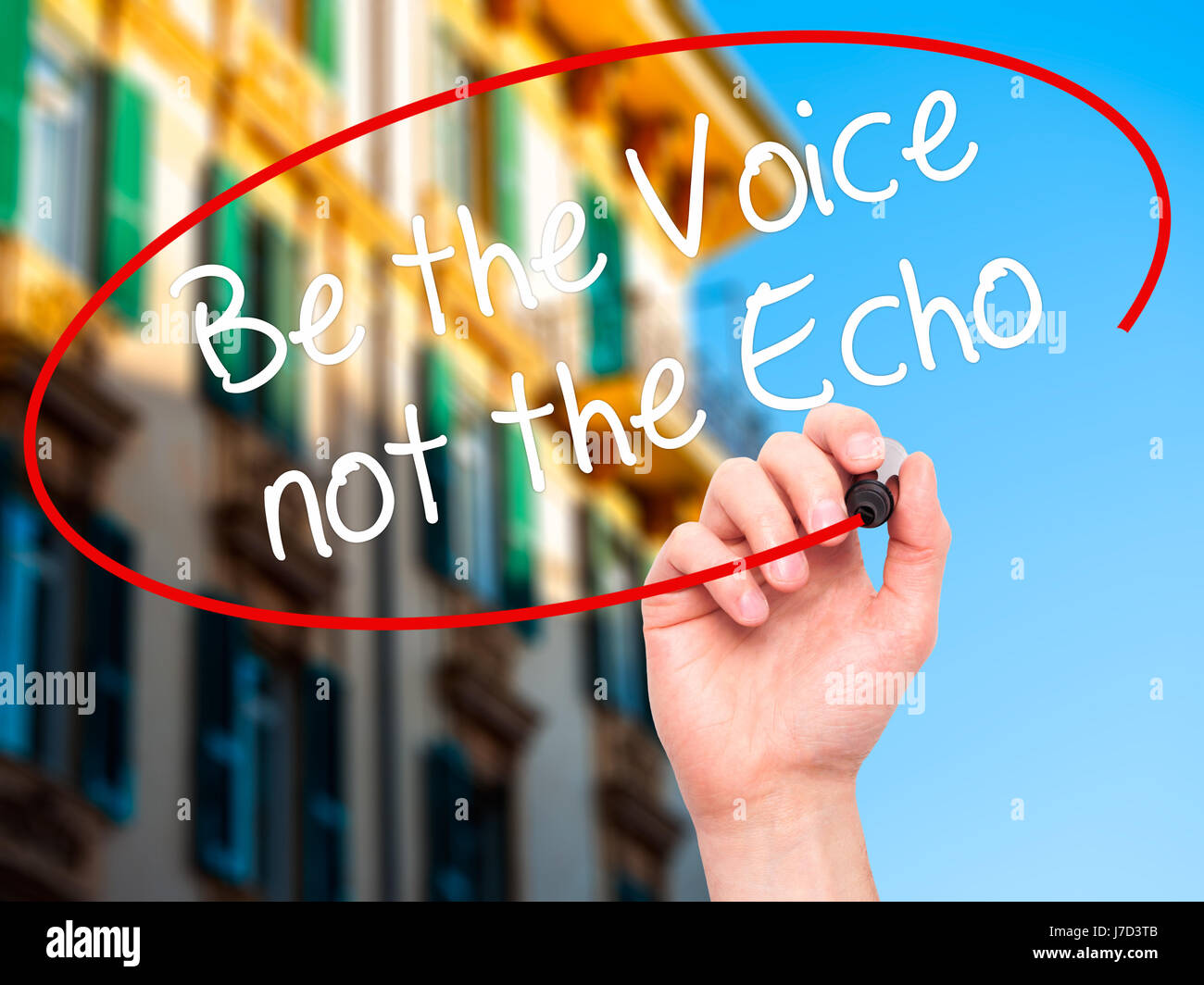 Man Hand writing Be the Voice not the Echo with black marker on visual ...